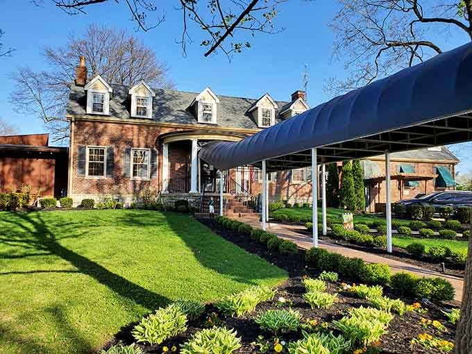 The brick facade and manicured grounds whisper "special occasion," but the welcoming vibe says "come as you are."