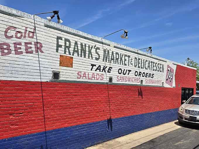 Frank's Market and Delicatessen proudly announces its mission in bold letters that promise satisfaction and delivery.