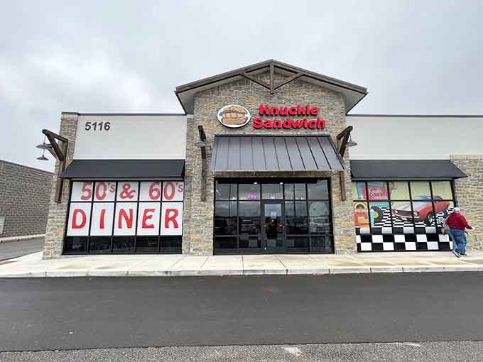 That bold red signage and checkered racing flag promise exactly what's inside: pure American diner joy.