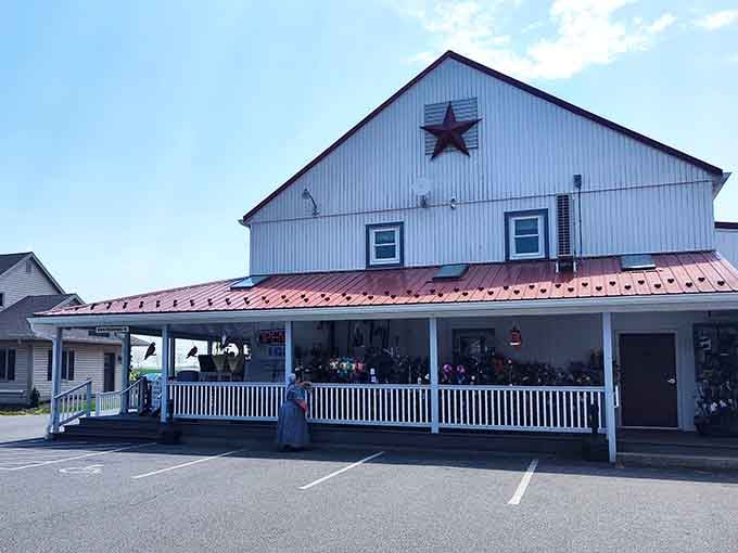 The covered porch practically whispers "sit here with your treats and watch the buggies roll by."