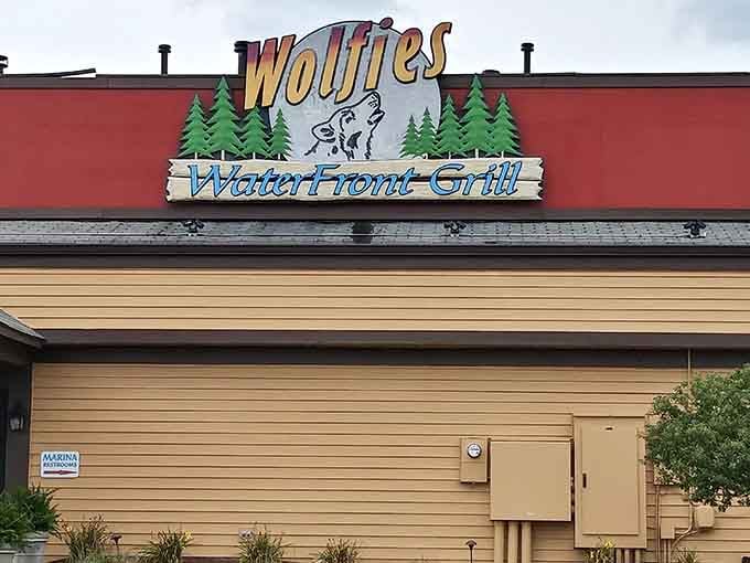 The wolf knows what's up, and so will you once you spot this cheerful sign welcoming you to waterfront paradise.