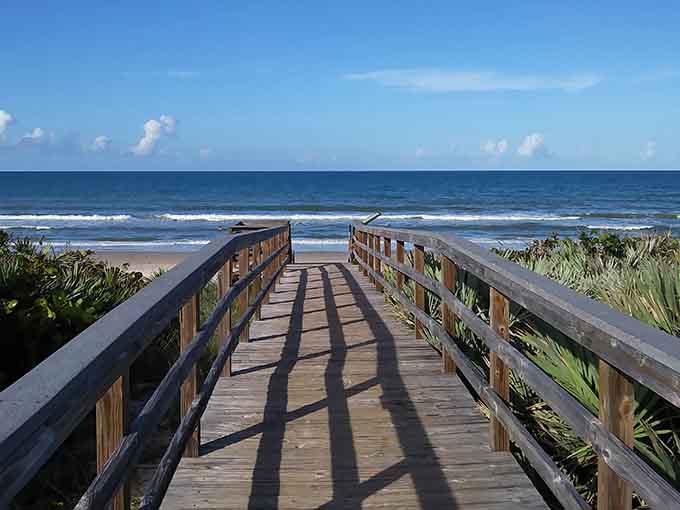 Your gateway to paradise: this charming boardwalk crosses the dunes and delivers you to the kind of peaceful beach day you've been dreaming about.