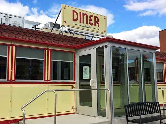 That red and cream exterior isn't just architecture – it's a time machine disguised as breakfast headquarters.