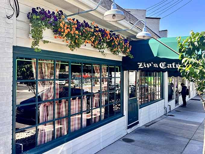 That cheerful awning and those flower baskets are basically waving you inside for burger therapy.