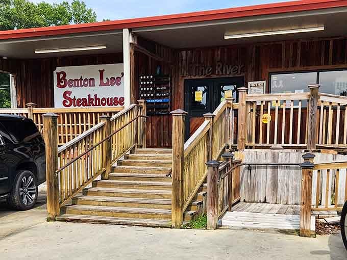 That welcoming wooden ramp leading to riverside steaks is your first clue you've found something special.
