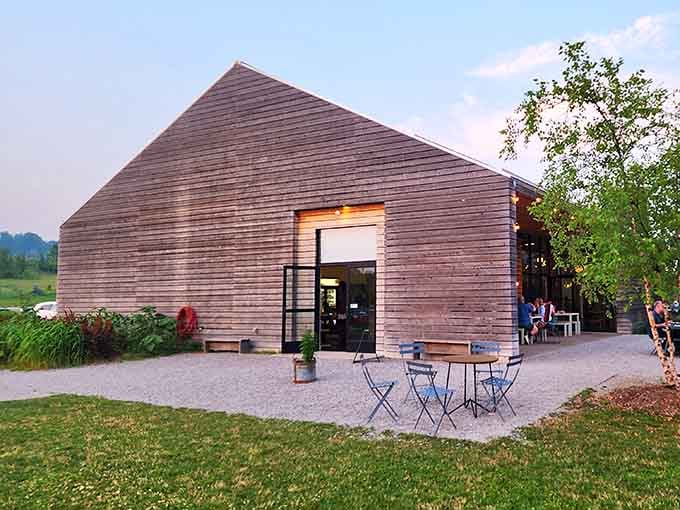 Modern barn architecture meets Michigan farmland at Farm Club, where dinner comes with a view of tomorrow's ingredients.