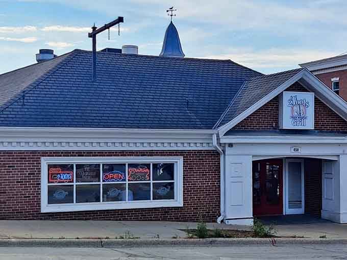 That charming brick facade hides one of Illinois's most delightful dining secrets: trains delivering your lunch overhead.