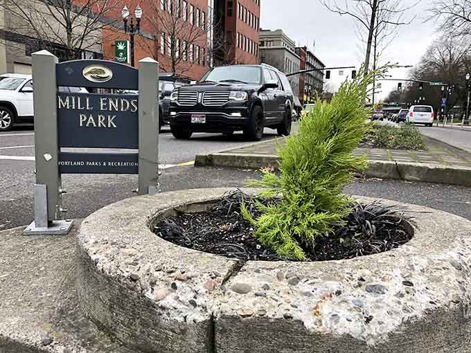This tiny circle of green has its own sign, its own story, and more charm than parks a thousand times its size.