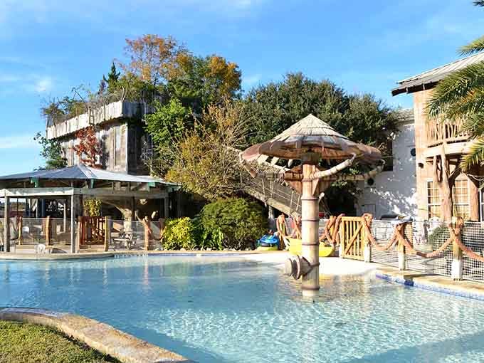 When your treehouse comes with a pool that wraps around like a liquid hug, you know someone understood the assignment perfectly.