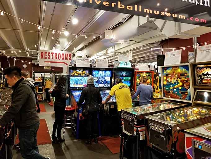 Rows of vintage pinball machines stand at attention like colorful soldiers from a more analog era of entertainment.