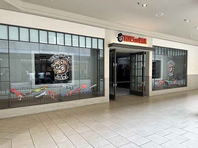 The storefront beckons with promises of foam-fueled mayhem, where shopping mall meets battlefield in the best possible way.