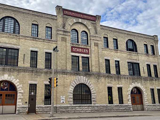 The old stables building stands proud, reminding us that before trucks, Clydesdales delivered liquid gold through Milwaukee's cobblestone streets.