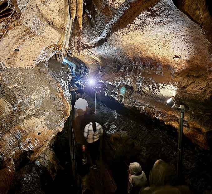 Underground passages lit like nature's own cathedral, where every step reveals another geological masterpiece in the making.