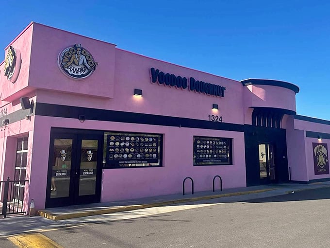 That pink exterior isn't whispering&mdash;it's shouting that something wonderfully weird is happening inside those walls.