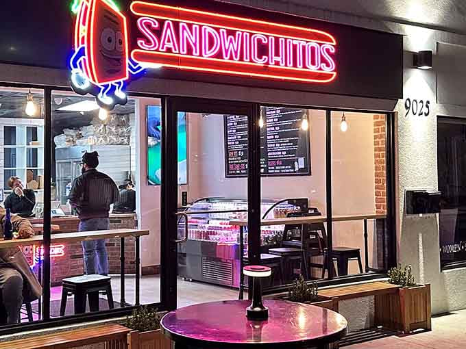 That glowing neon sign isn't just decoration, it's a promise of sandwich excellence waiting inside Sandwichitos.