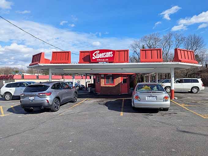That iconic red canopy signals happiness ahead, where carhops sprint and burgers arrive faster than you can say "Galley Boy."