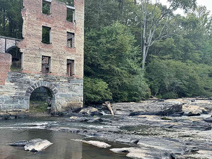 Water rushing over ancient rocks while Civil War ruins stand watch—this is where history meets nature in spectacular fashion.