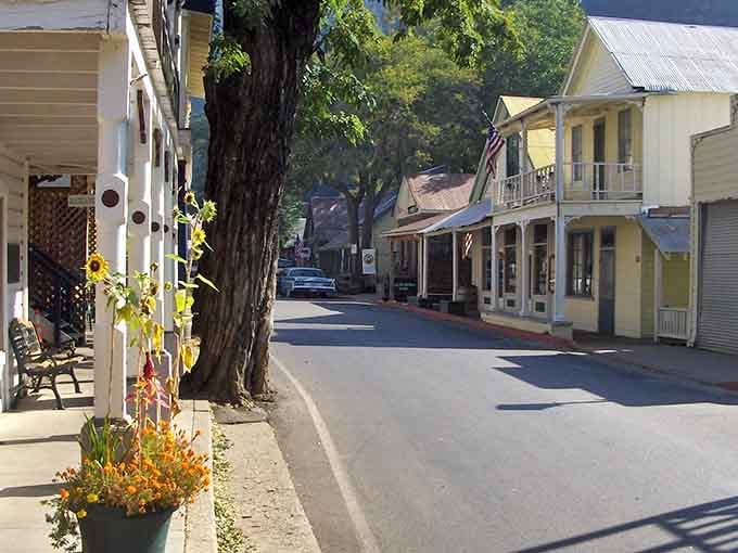 That flower planter adds a touch of charm to a street that still feels ruggedly rooted in Gold Rush history.