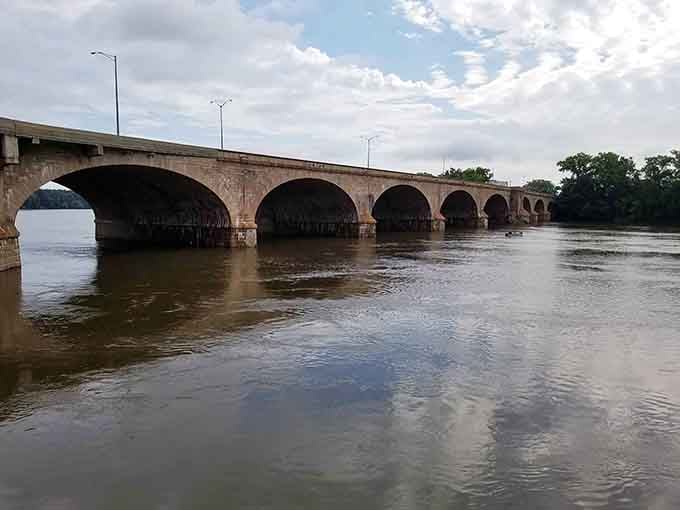 Stone arches marching across the Connecticut River like they own the place—because honestly, they do.