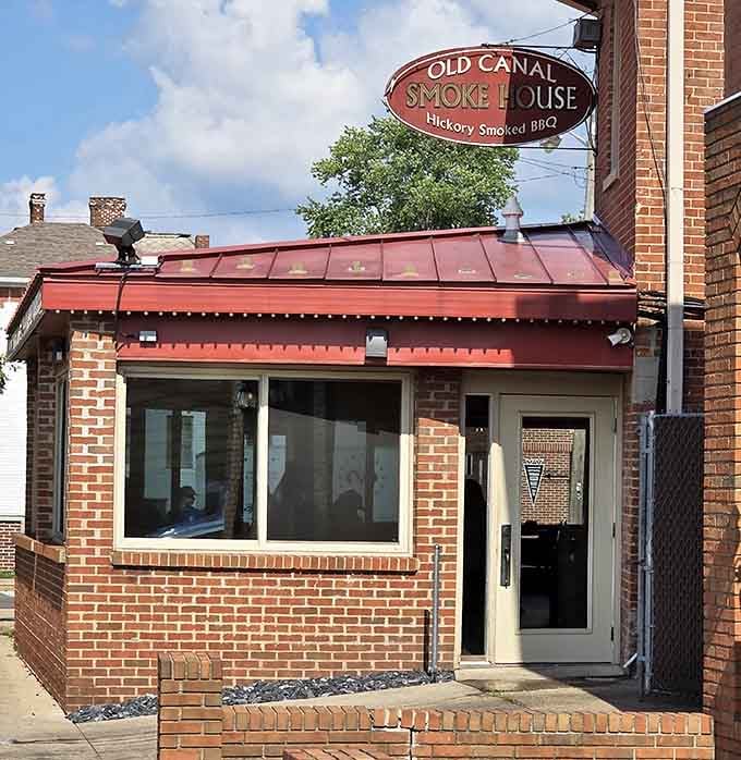 The sign hanging proud above the awning, announcing hickory-smoked perfection to anyone within eyeshot or nose-shot of this place.