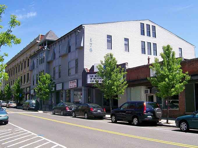 Downtown Naugatuck wears its history like a comfortable cardigan, with tree-lined streets that remember when Main Street actually meant something.