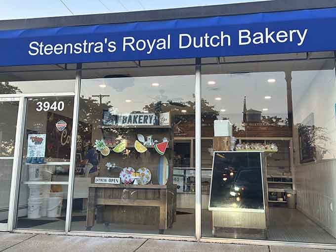 That blue awning beckons like a lighthouse guiding ships to shore, except here the treasure is pastries.