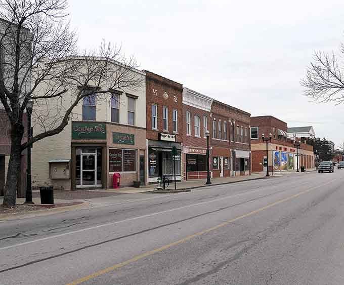 Main Street architecture tells stories without saying a word, brick facades standing proud like they've earned their place.