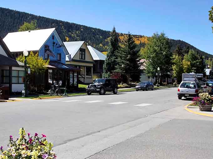 Victorian charm meets mountain majesty on streets where every building tells a colorful story worth hearing.