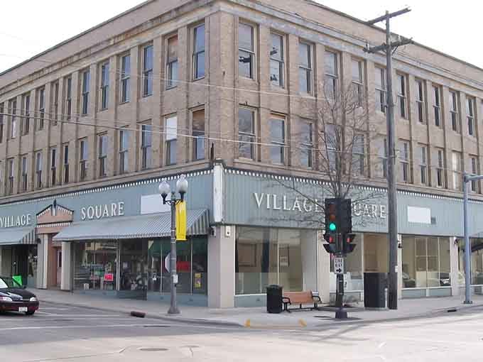 Historic buildings house modern businesses in downtown Manitowoc, blending the past with present-day community life and affordable urban living.