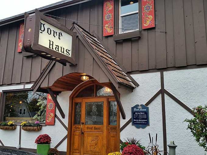 That Alpine facade with carved wooden doors isn't just charming, it's your passport to another era entirely.