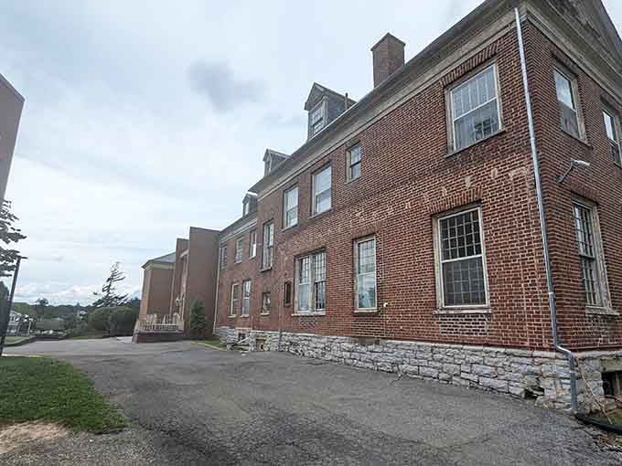 The imposing brick facade stands sentinel over Radford, a monument to a complicated past that refuses to fade quietly.