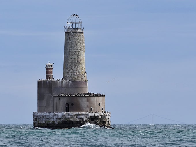 Standing alone in the Straits of Mackinac, this crumbling sentinel has been slowly surrendering to Lake Michigan since 1912.