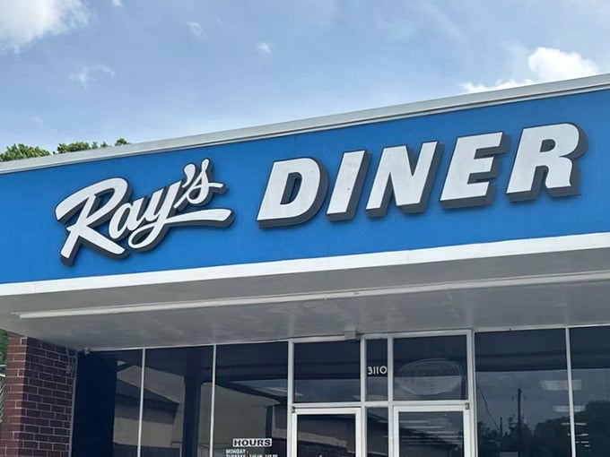 That bright blue sign isn't just directing you to breakfast, it's pointing toward pure morning happiness.