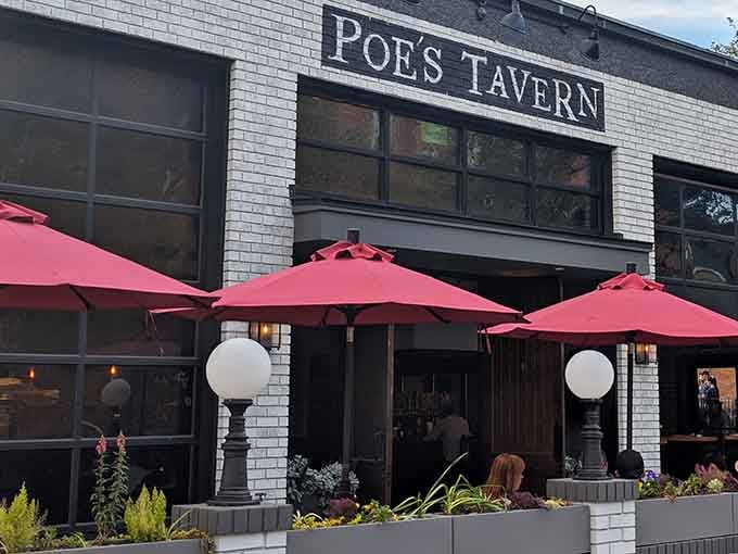 Those cheerful red umbrellas prove that even Edgar Allan Poe's legacy can brighten up on a sunny day.