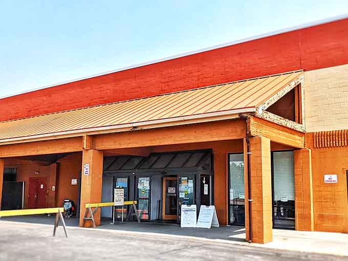 That bold orange awning beckons like a beacon for bargain hunters who know true treasure hunting starts here.