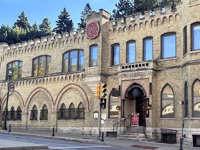 Those arched windows and battlements aren't just for show, they're a love letter to brewing tradition written in brick and stone.