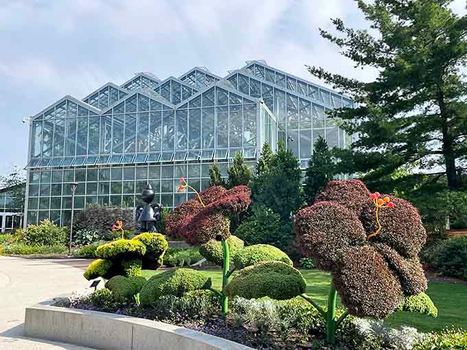 Those topiary sculptures look like they escaped from Edward Scissorhands, and honestly, we're here for it.