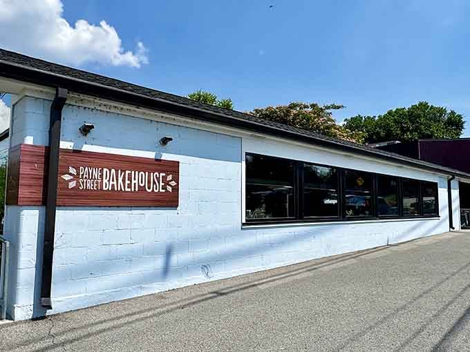 That crisp white exterior with the warm wood sign is basically waving you inside for pie and happiness.
