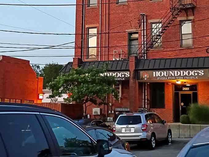 Evening light hits the classic brick building, and you can almost hear the pizza calling your name from inside those doors.