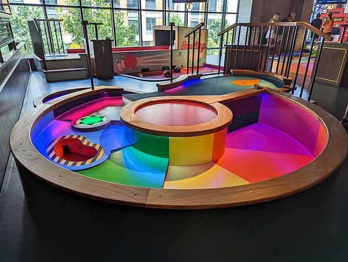 Circular courses with gradient colors that shift like a sunset; this is mini golf designed by someone who actually cares about aesthetics.