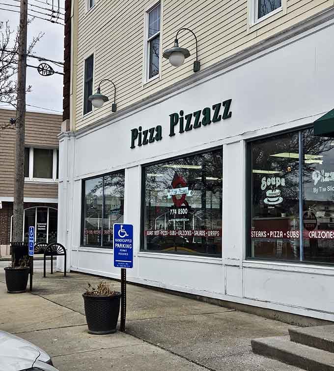 That classic storefront with big windows practically whispers "come in, we've been waiting for you with hot pizza."