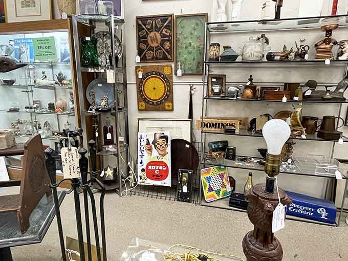 Vintage advertising signs share space with antique clocks and curiosities, proving one person's attic cleanout is another's treasure trove.