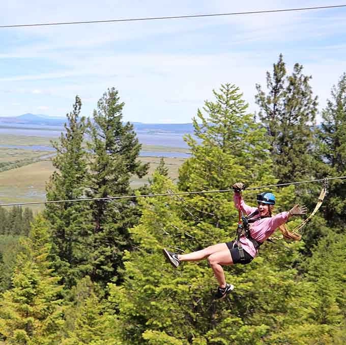 Arms spread wide in pure joy because sometimes the best response to adventure is complete surrender.
