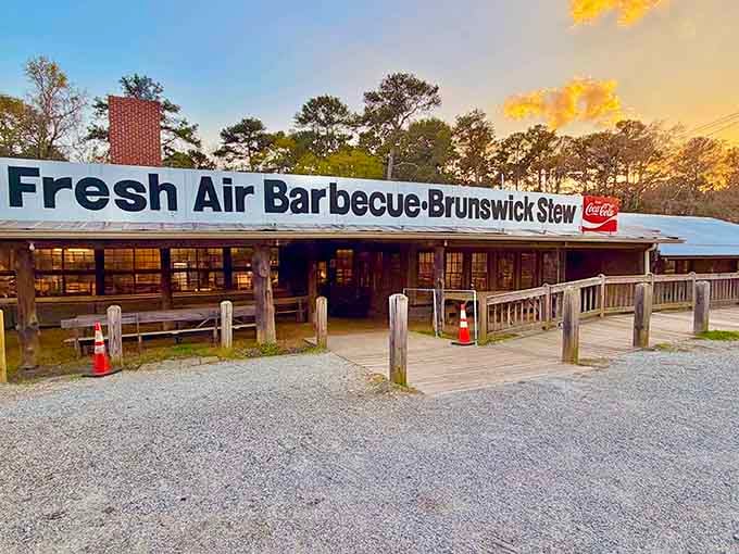 Fresh Air Barbecue's timeless facade glows beautifully at sunset, inviting you to experience nearly a century of barbecue tradition in Jackson, Georgia's beloved landmark.
