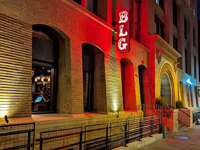 That illuminated facade isn't just showing off, it's announcing that something special awaits inside those arched doorways.