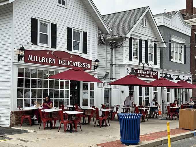Those crimson awnings beckon like a lighthouse guiding hungry souls to sandwich salvation on a charming downtown street.