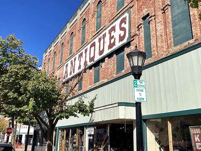 That vintage "ANTIQUES" sign isn't just advertising, it's practically a beacon calling treasure hunters home to Bay City.