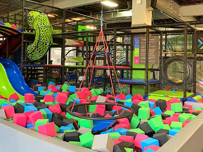 That foam pit looks like someone dumped out every Rubik's Cube ever made and invited everyone to dive in.