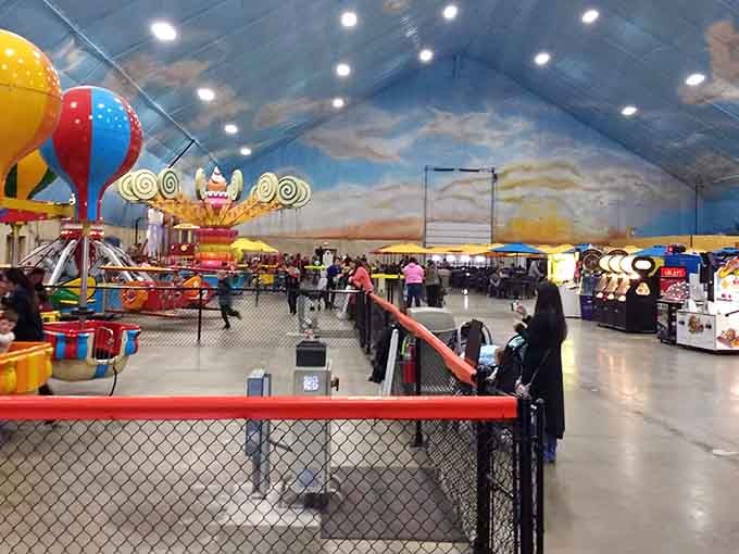 That painted sky ceiling creates an outdoor illusion so convincing you'll forget winter exists beyond these walls.
