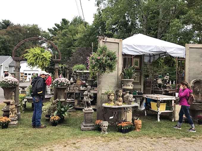 Garden statuary and planters creating an outdoor oasis, proving one person's lawn ornament is another's design statement.